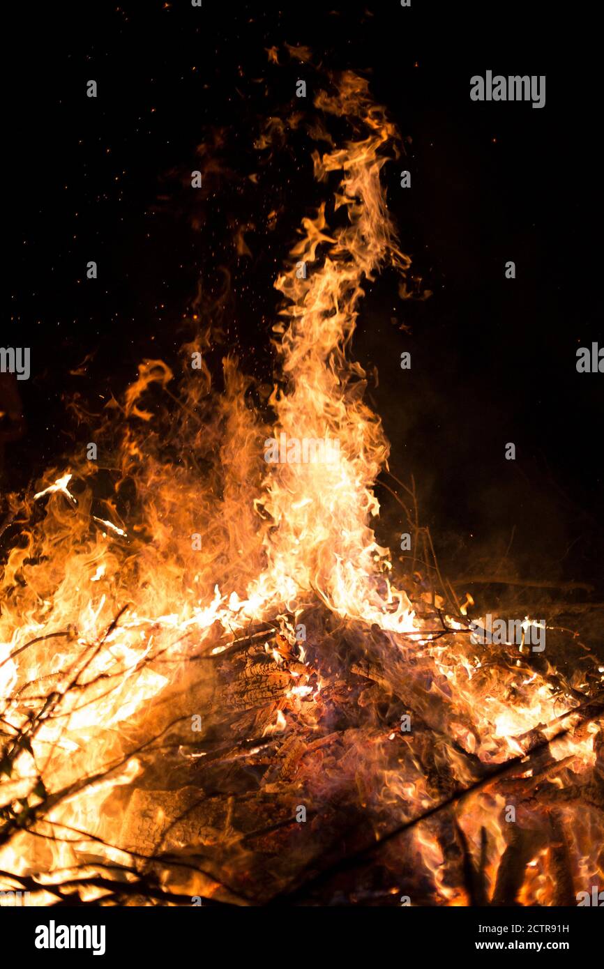 Flaming Embers spreading from Bonfire at Night Stock Photo - Alamy
