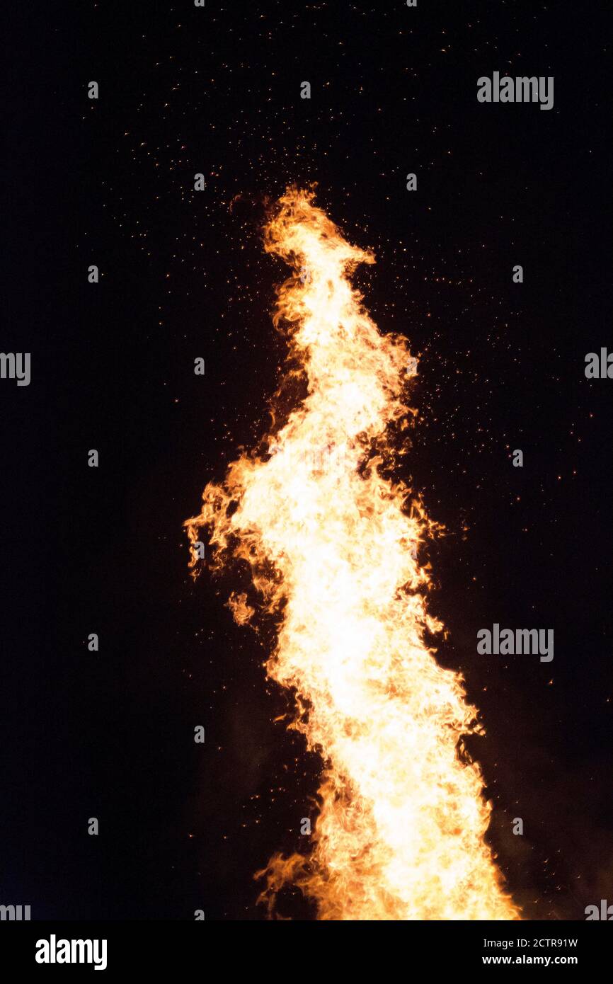 Flaming Embers spreading from Bonfire at Night Stock Photo - Alamy