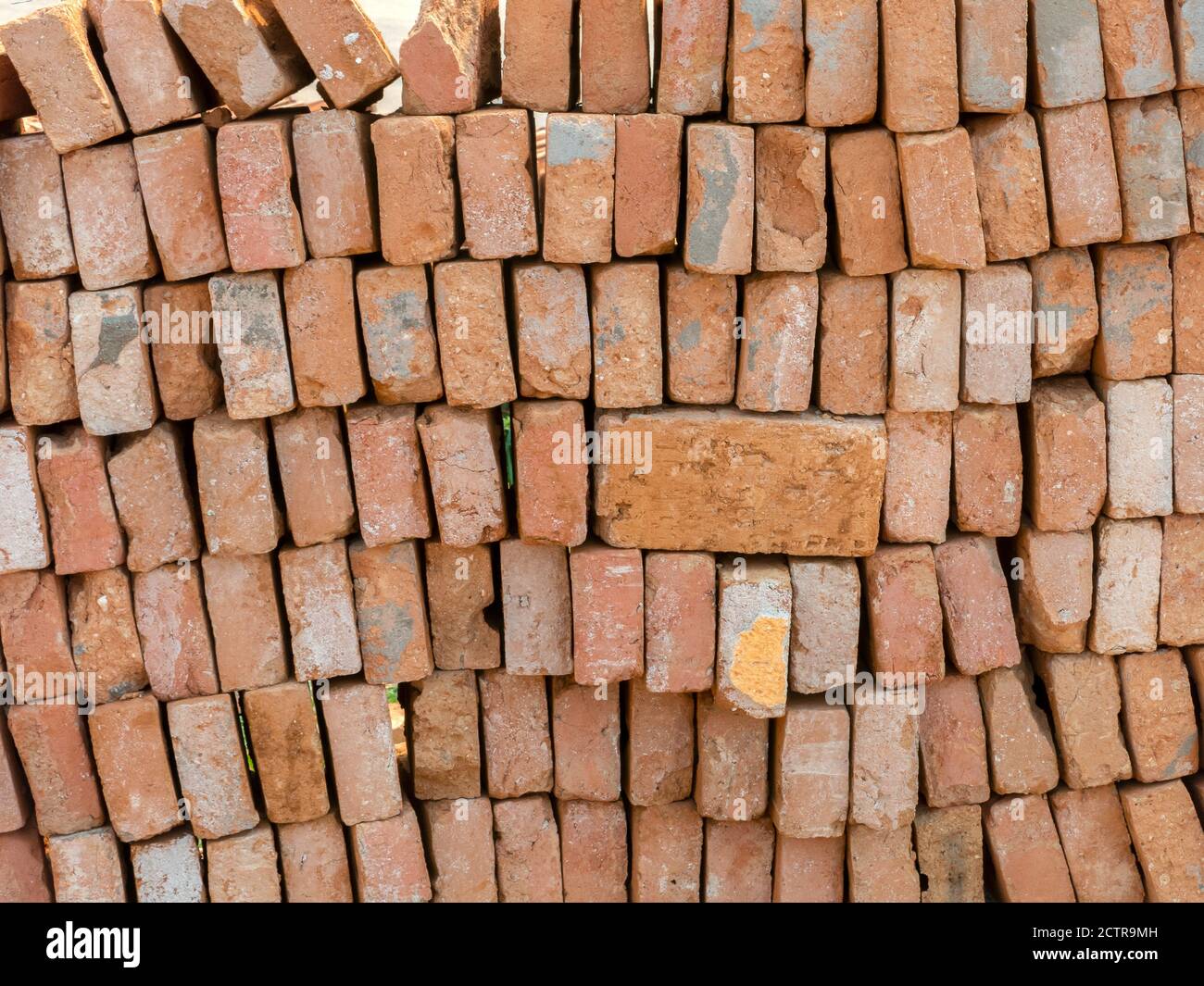 Stacked used clay brick for reuse Stock Photo - Alamy