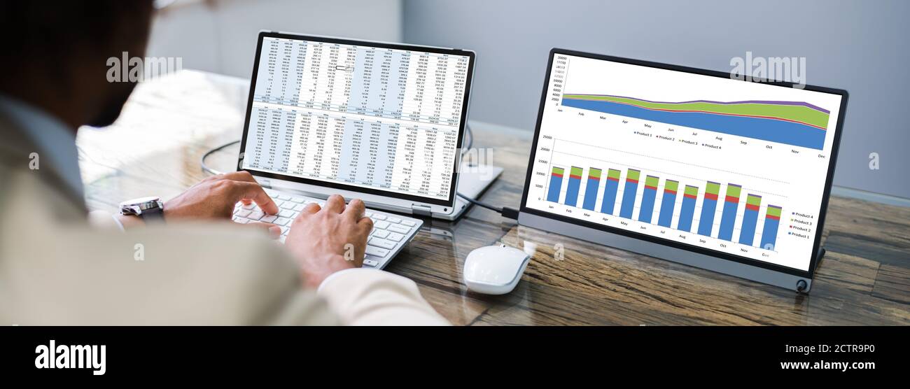 Analyst Working With Spreadsheet Data On Computer Stock Photo - Alamy