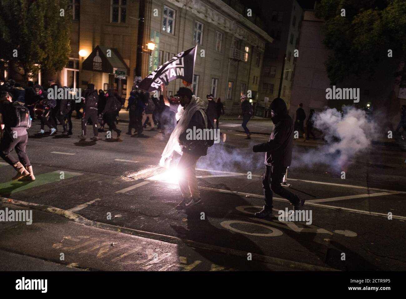 Seattle, USA - Sep - 23, 2020: A flash bang going off as Police push ...