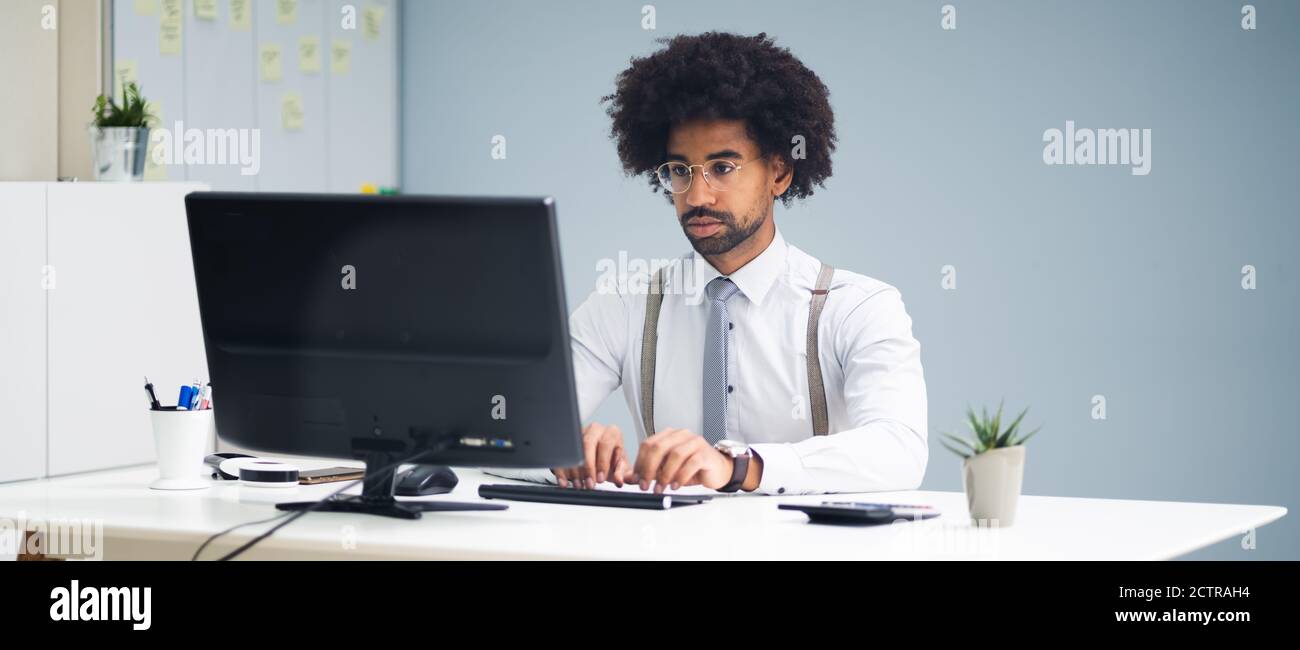African American Business Man Using Computer In Office Stock Photo - Alamy