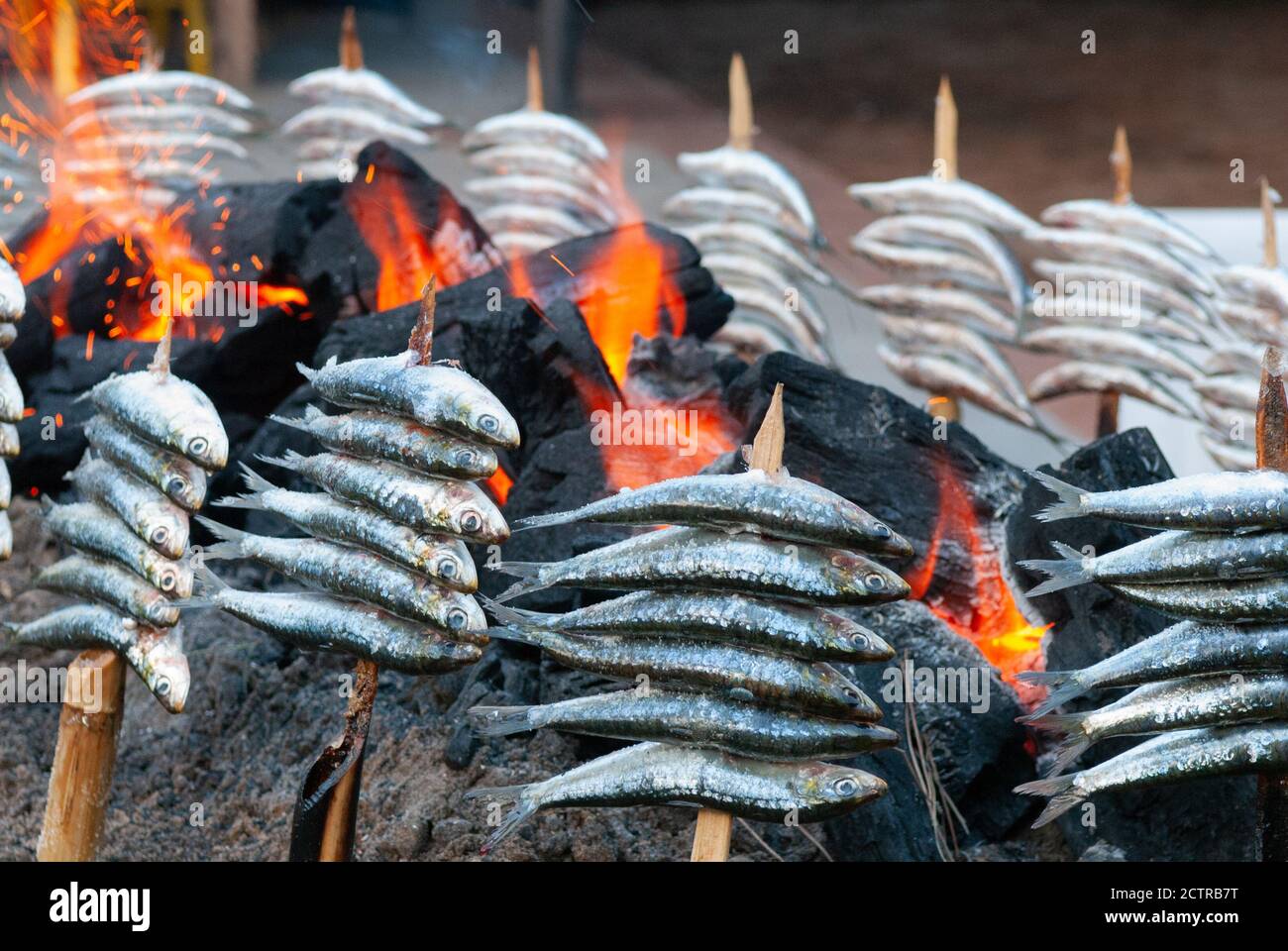 traditional skewer of sardines on fire Stock Photo - Alamy
