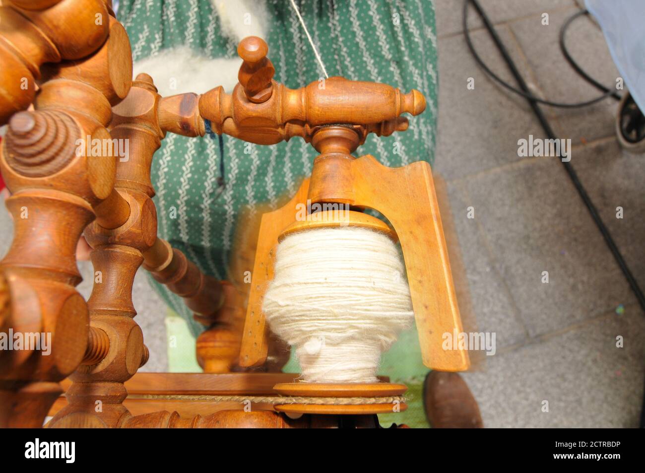 traditional wool spinning on a spinning wheel, fashion and design Stock ...