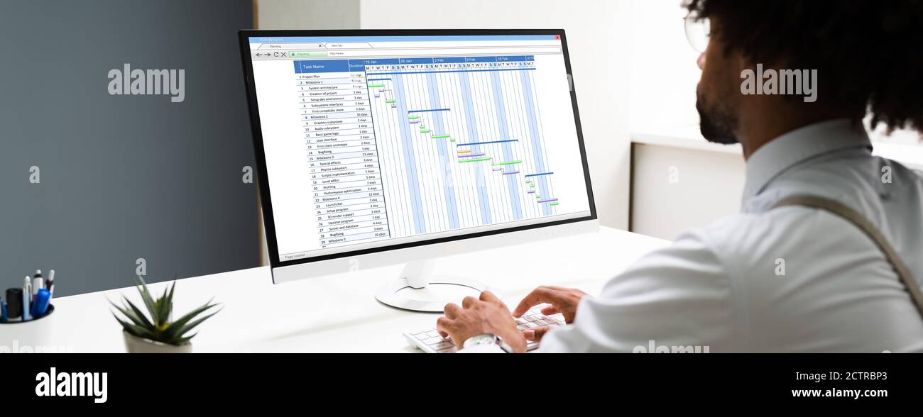 Close-up Of A Businessman Working On Gantt Chart Using Computer On ...