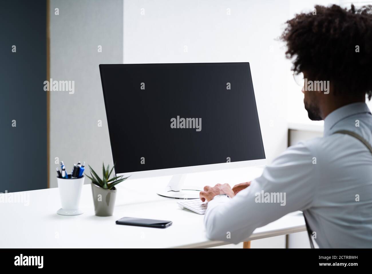 African american male typing hi-res stock photography and images - Alamy
