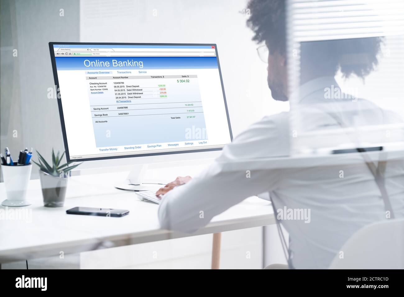 African American Using Online Bank Account Through Internet Stock Photo ...
