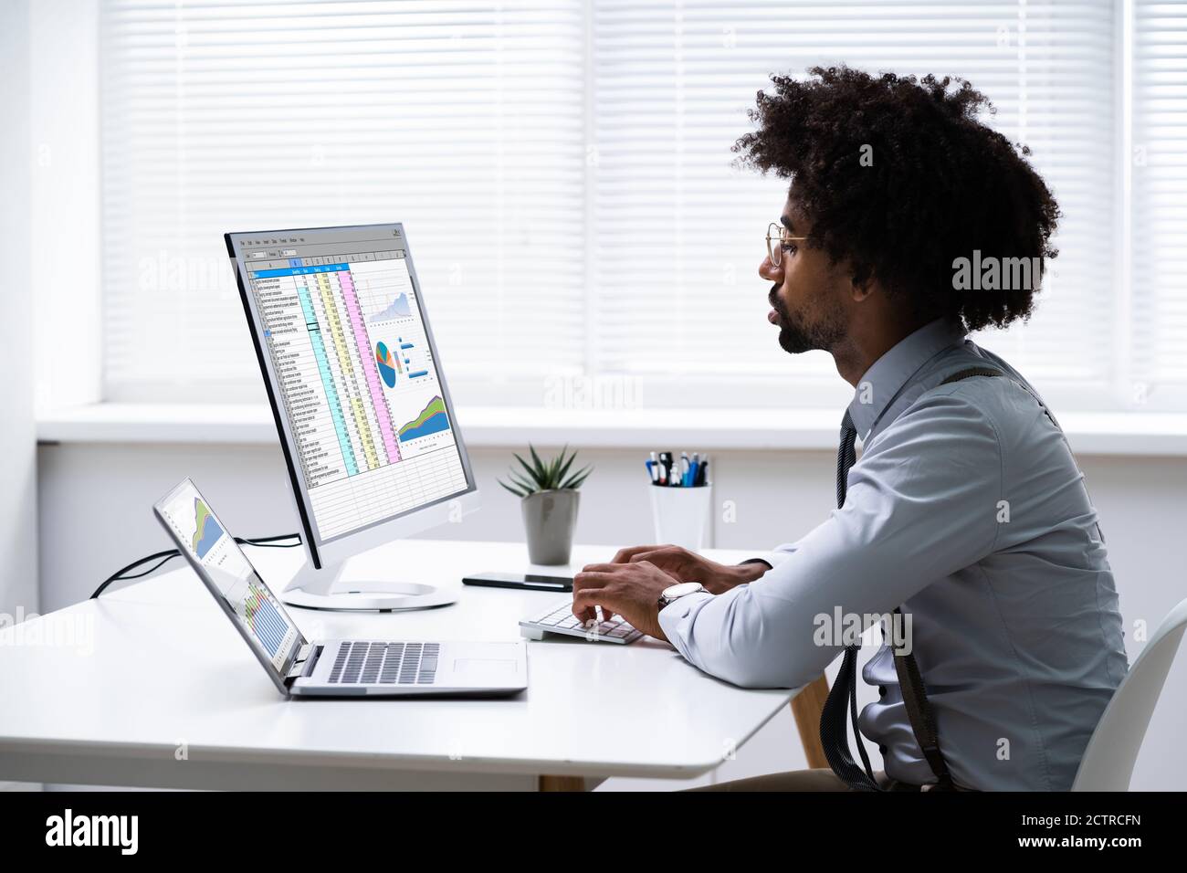 Analyst Employee Working With Spreadsheet On Computer Stock Photo - Alamy
