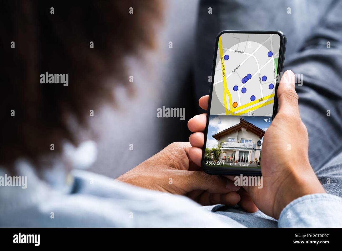 African American Searching Real Estate House On Map Stock Photo - Alamy
