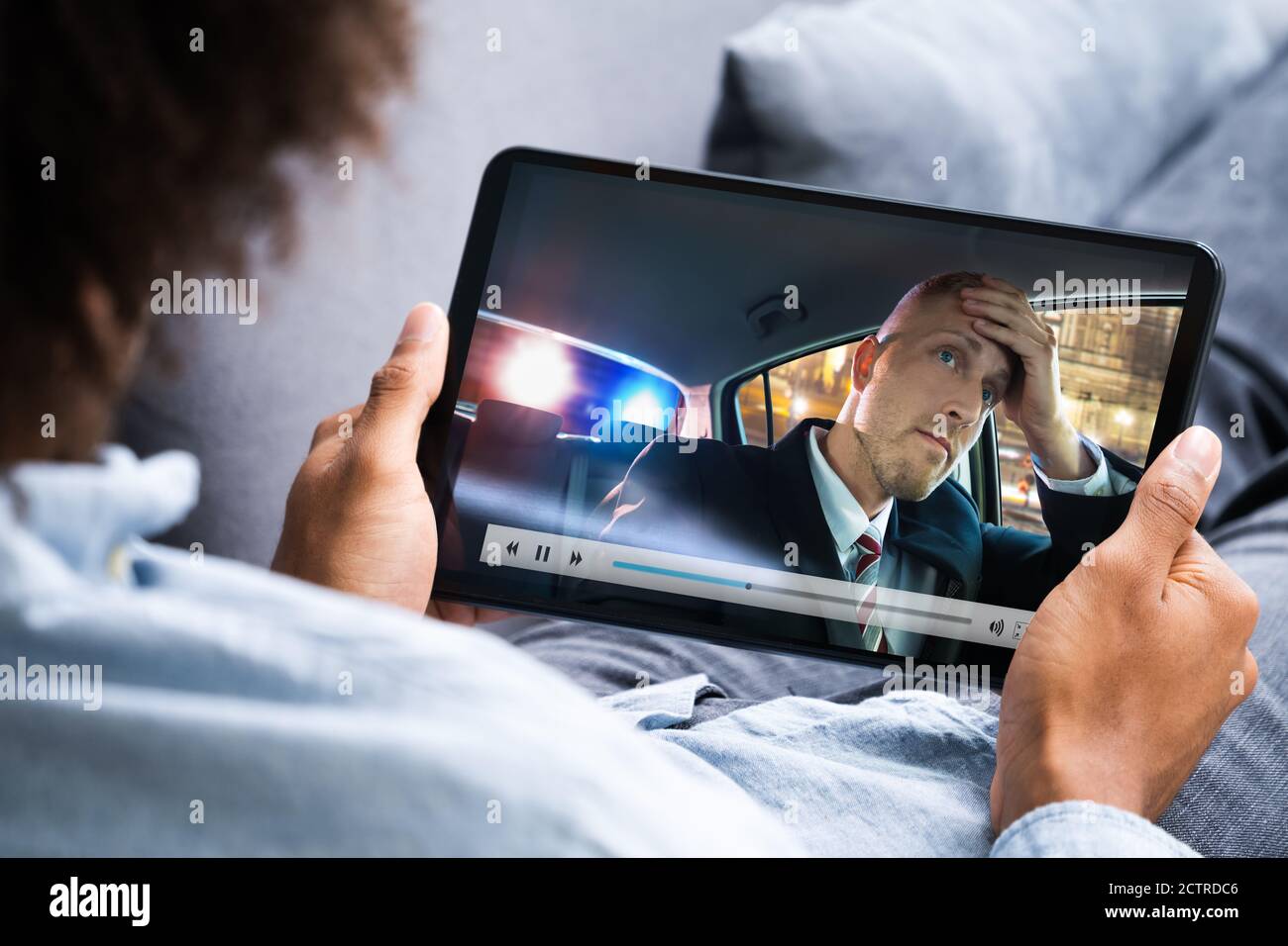 Movie playing tablet hi-res stock photography and images - Alamy