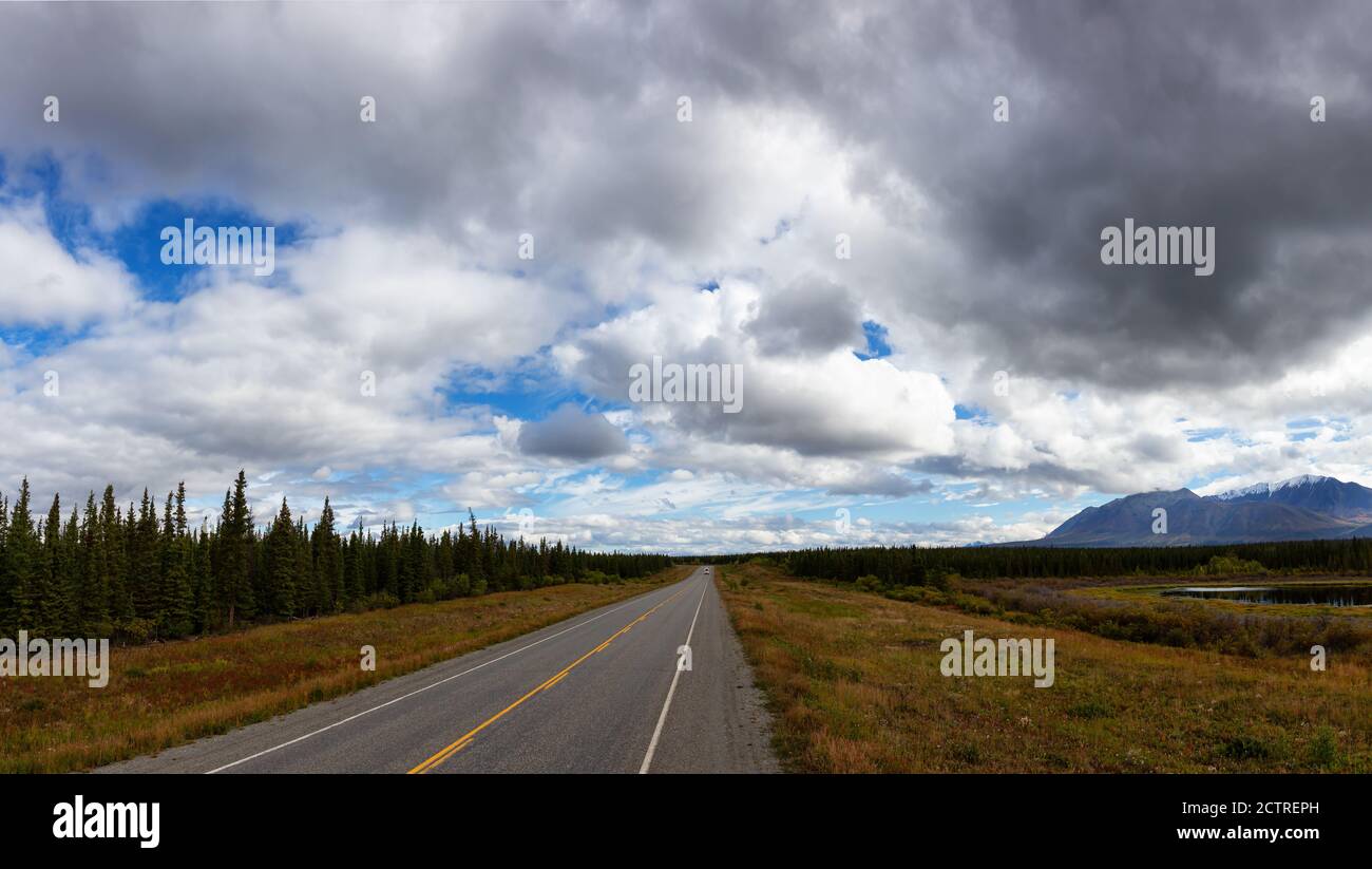 Scenic Route, Alaska Hwy, during a sunny and cloudy day Stock Photo - Alamy