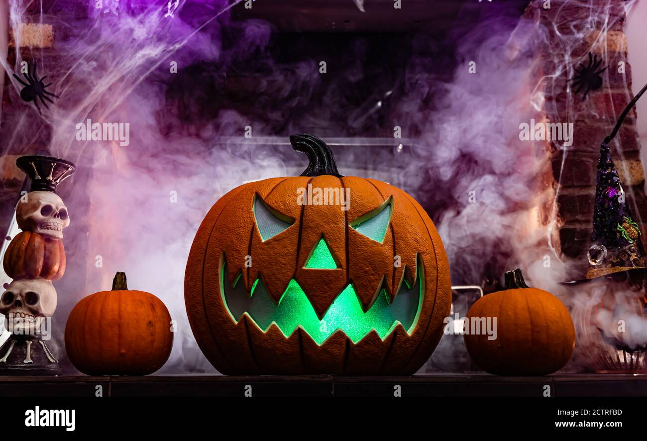 Haunted Halloween Fireplace theme with lights pumpkins and cobwebs ...