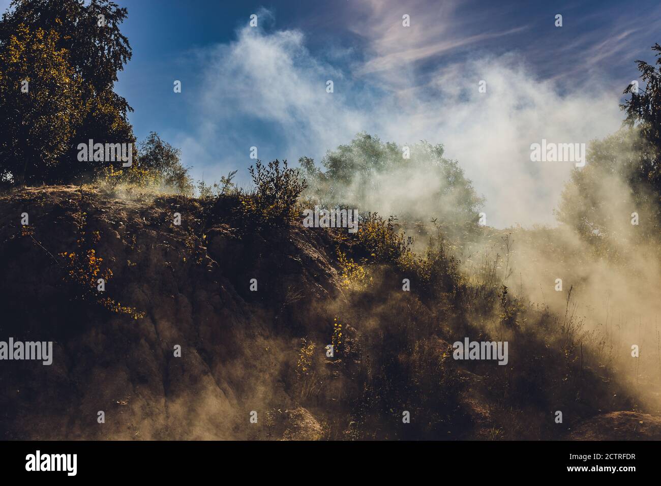 Dense White Smoke Rising from the Raging Wildfire Stock Photo - Alamy
