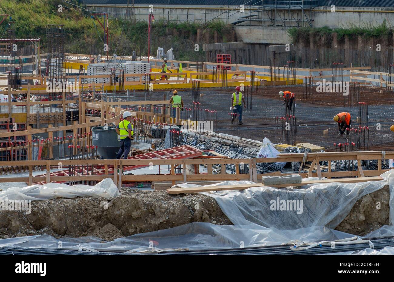 Milan italy september 8 2020: construction workers preparing the base ...