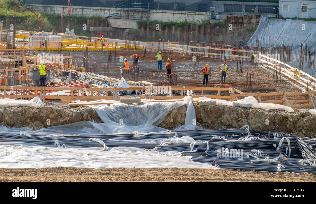 Milan italy september 8 2020: construction workers preparing the base ...