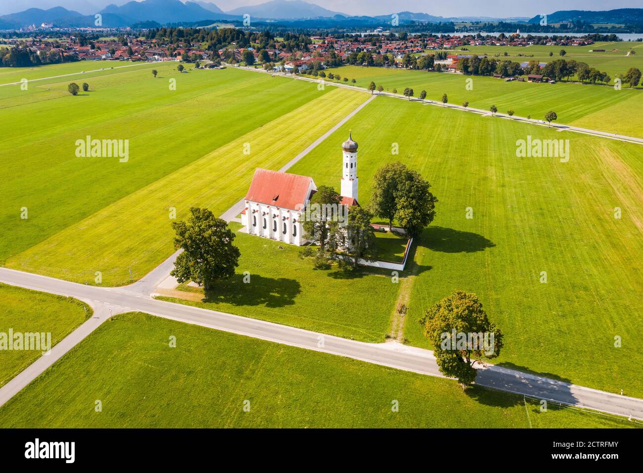 Aerial view of church near Schwangau on summer day, Forggensee in ...