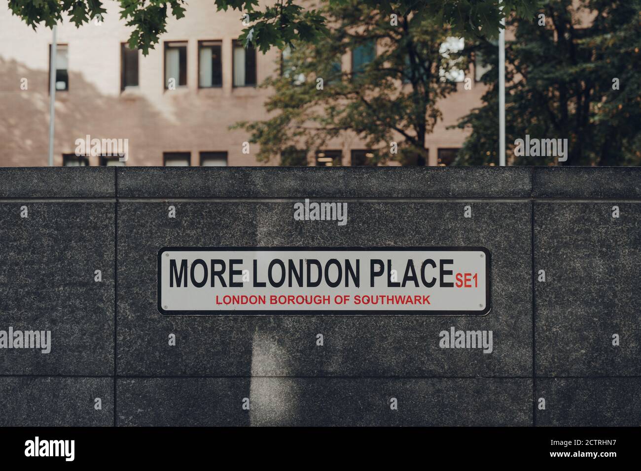 London, UK - August 25, 2020: Street name sign on More London Place, a ...