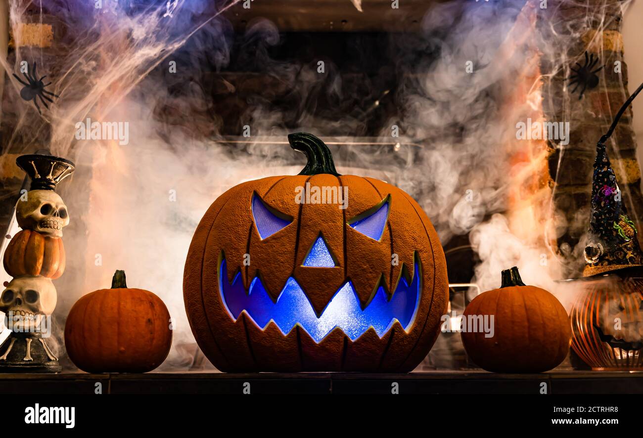Haunted Halloween Fireplace theme with lights pumpkins and cobwebs ...