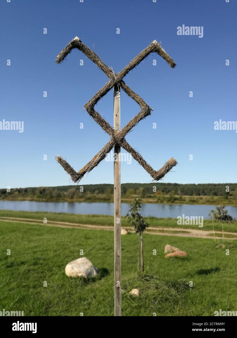 Old Lithuania Balt pagans symbol made from hey in front of blue sky ...
