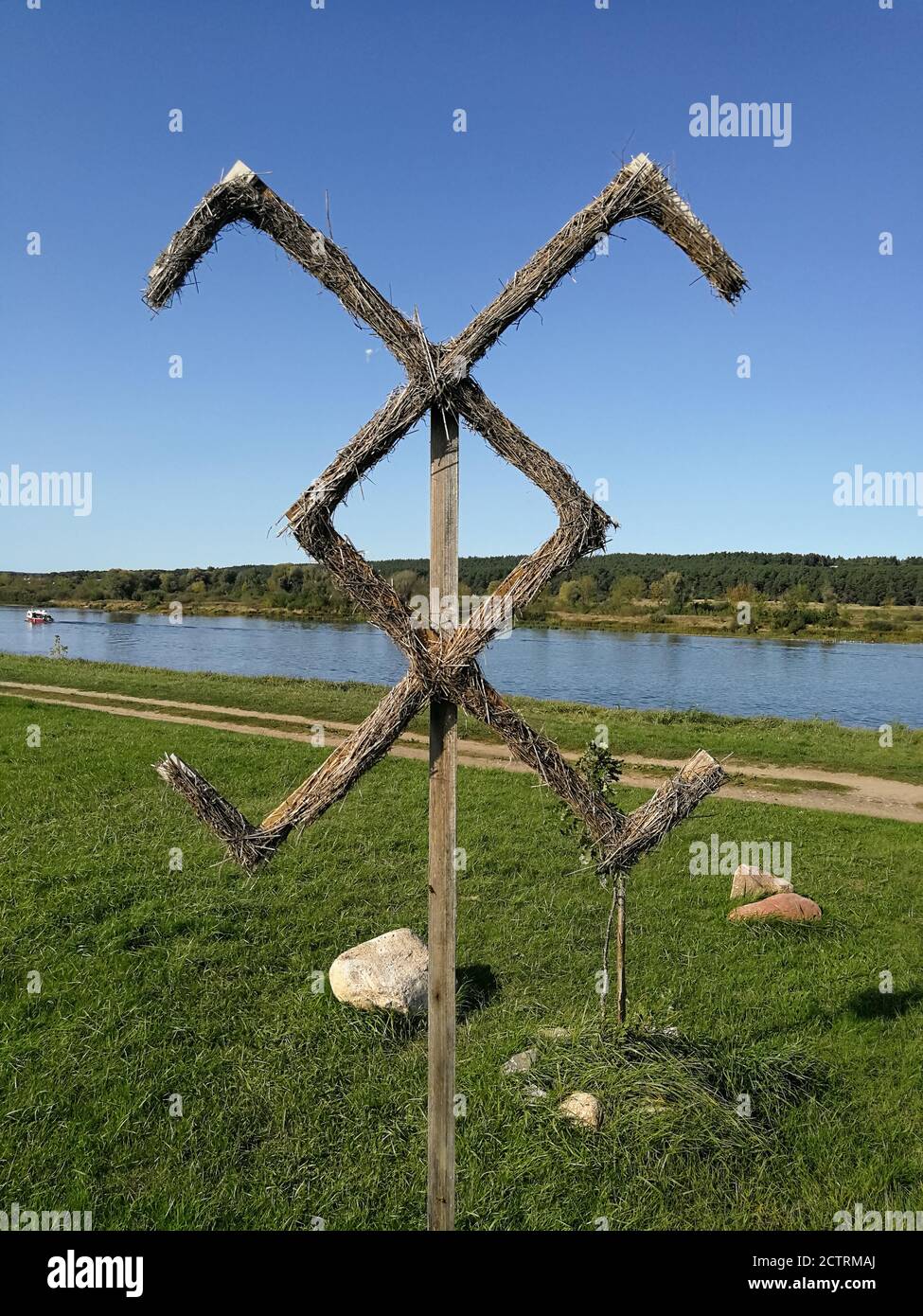 Old Lithuania Balt pagans symbol made from hey in front of blue sky ...