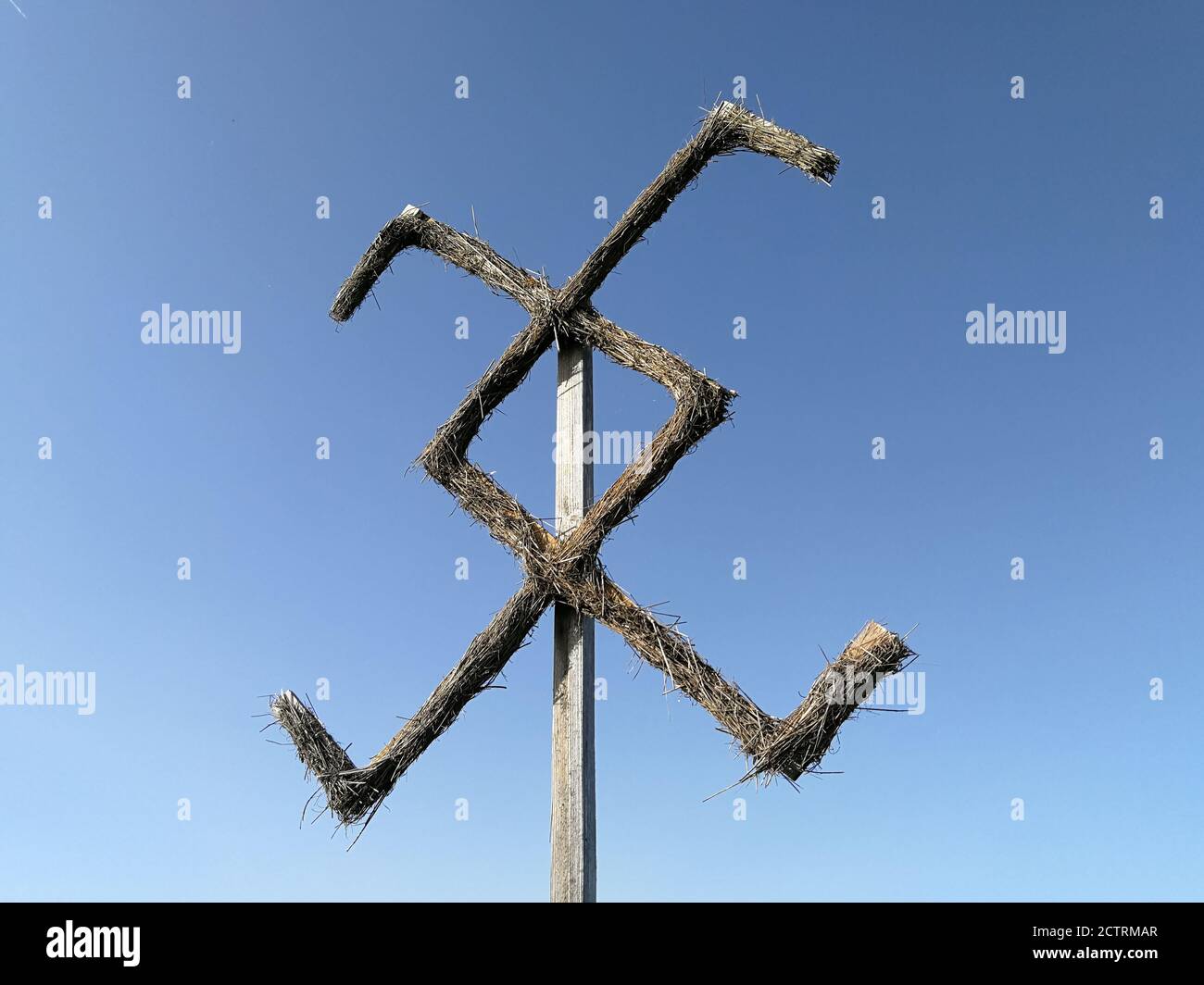 Old Lithuania Balt pagans symbol made from hey in front of blue sky ...