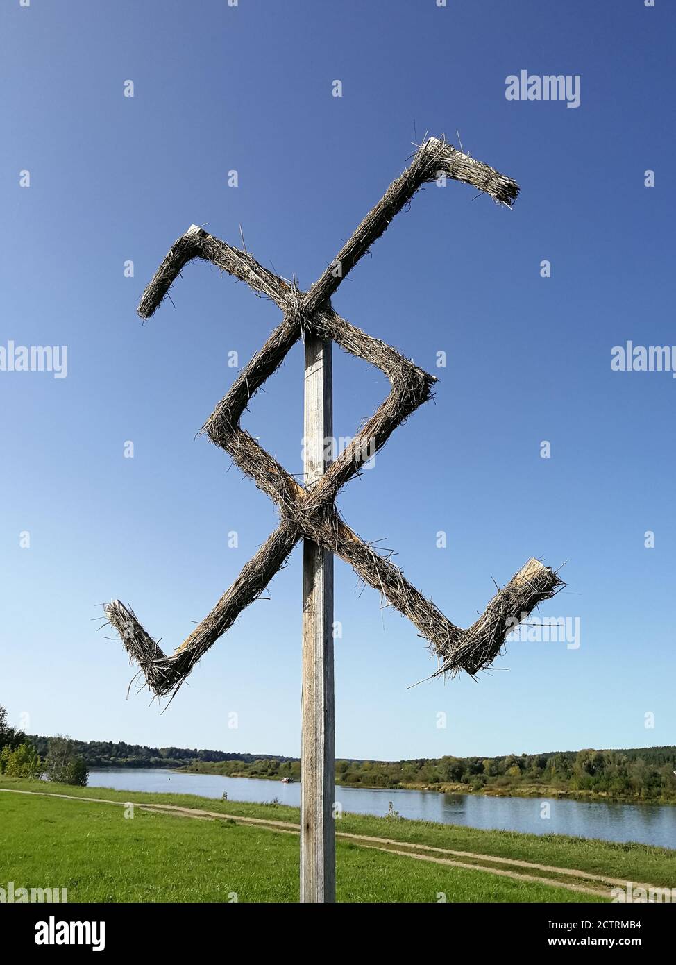Old Lithuania Balt pagans symbol made from hey in front of blue sky ...