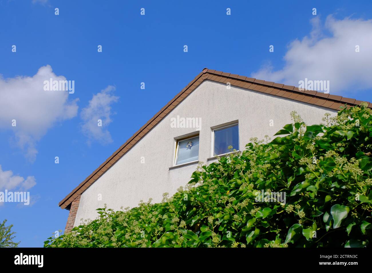 Low angle shot of a house on a blue sky background Stock Photo - Alamy