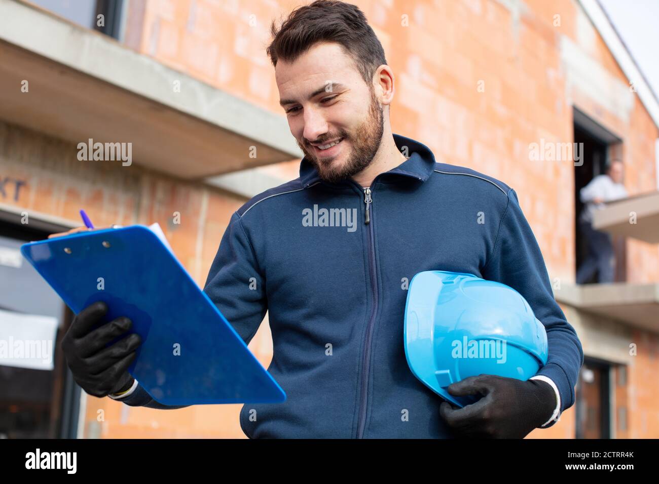 construction manager writing report at construction site Stock Photo ...