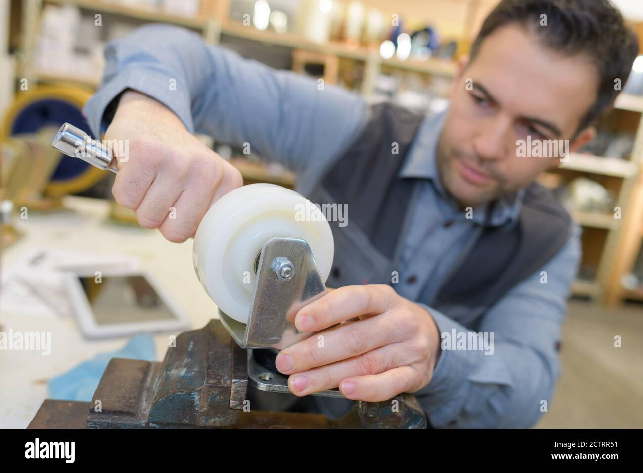 engineer working on wheel of cart Stock Photo - Alamy