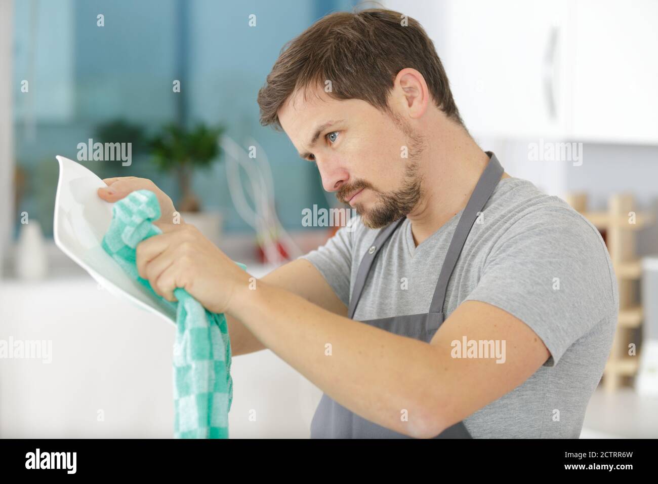 single man cleaning at home Stock Photo - Alamy
