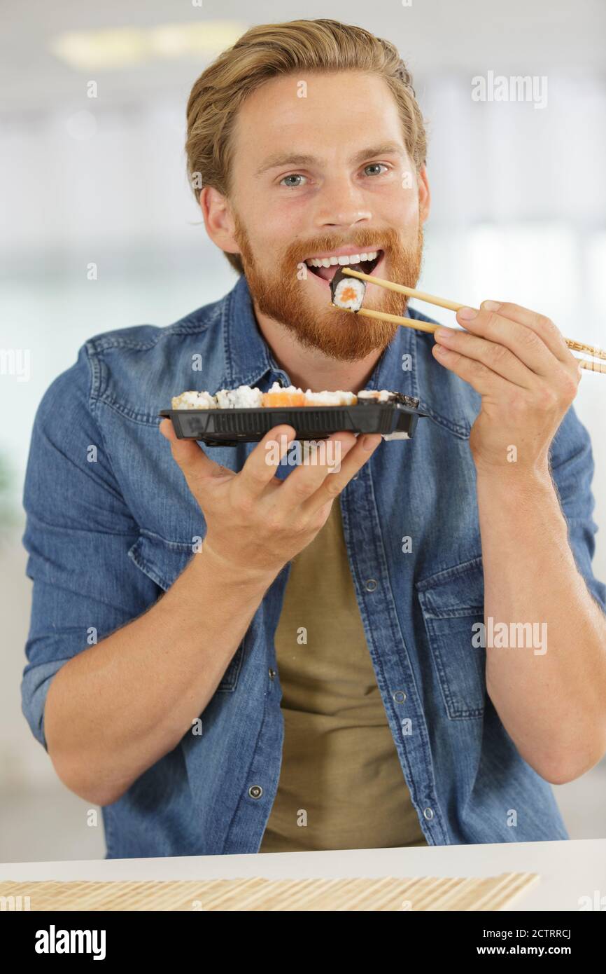 Man eating sushi hi-res stock photography and images - Alamy