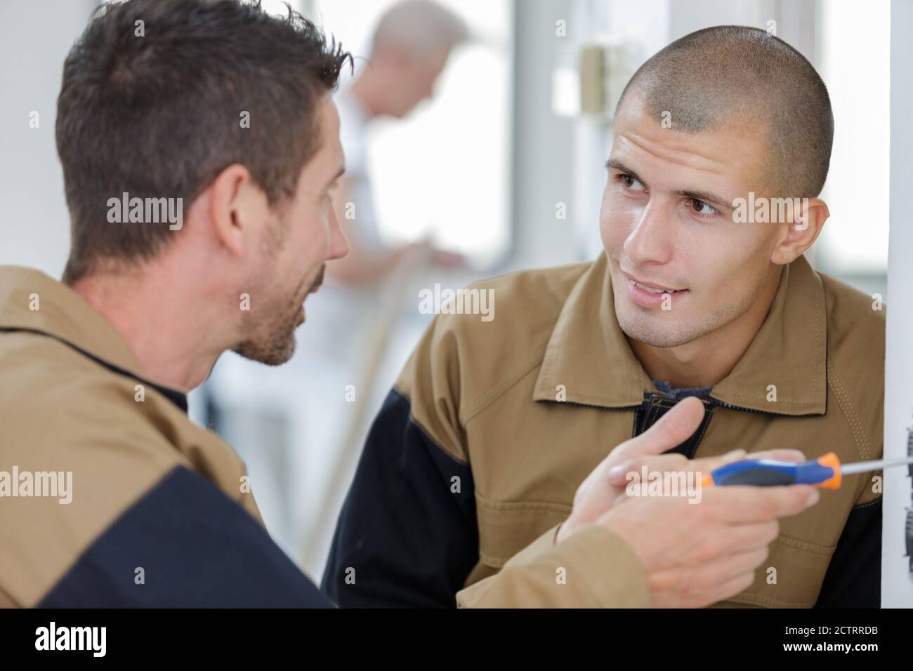 apprentice and mentor working together Stock Photo - Alamy