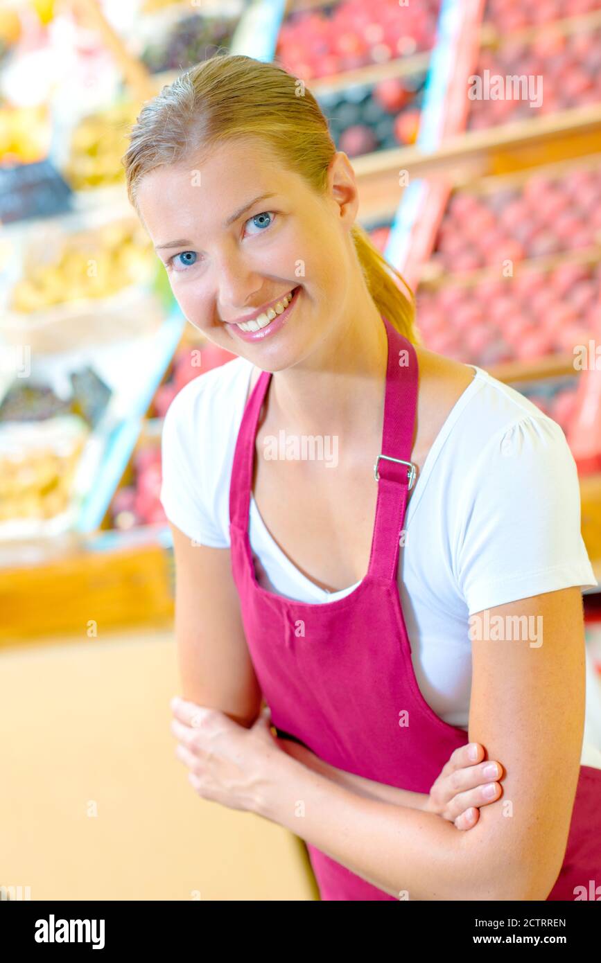 a happy supermarket employee smiles Stock Photo - Alamy