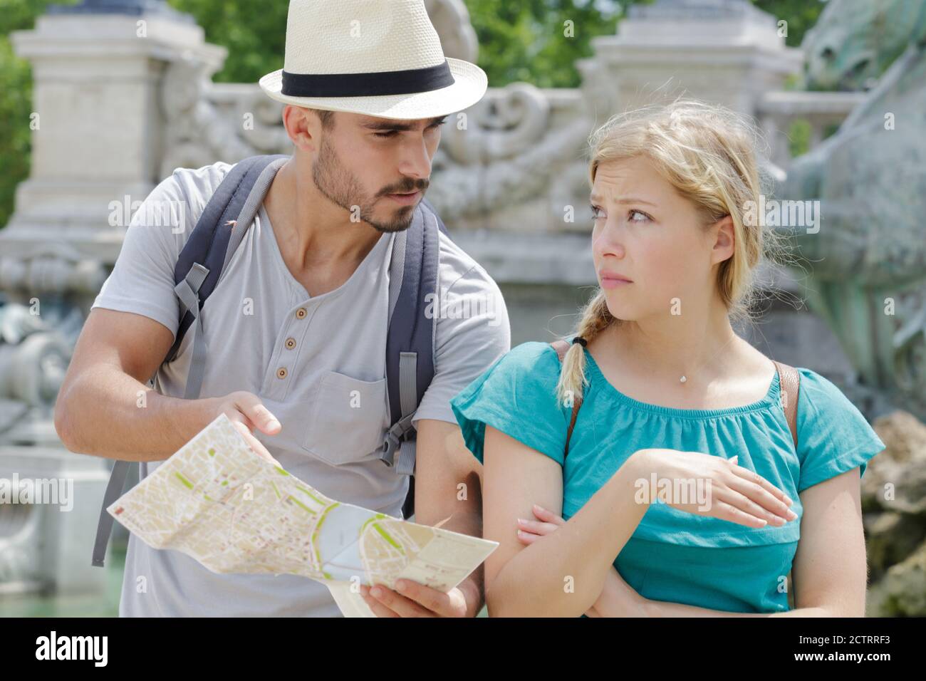 man with map shows girlfriend the right direction Stock Photo - Alamy