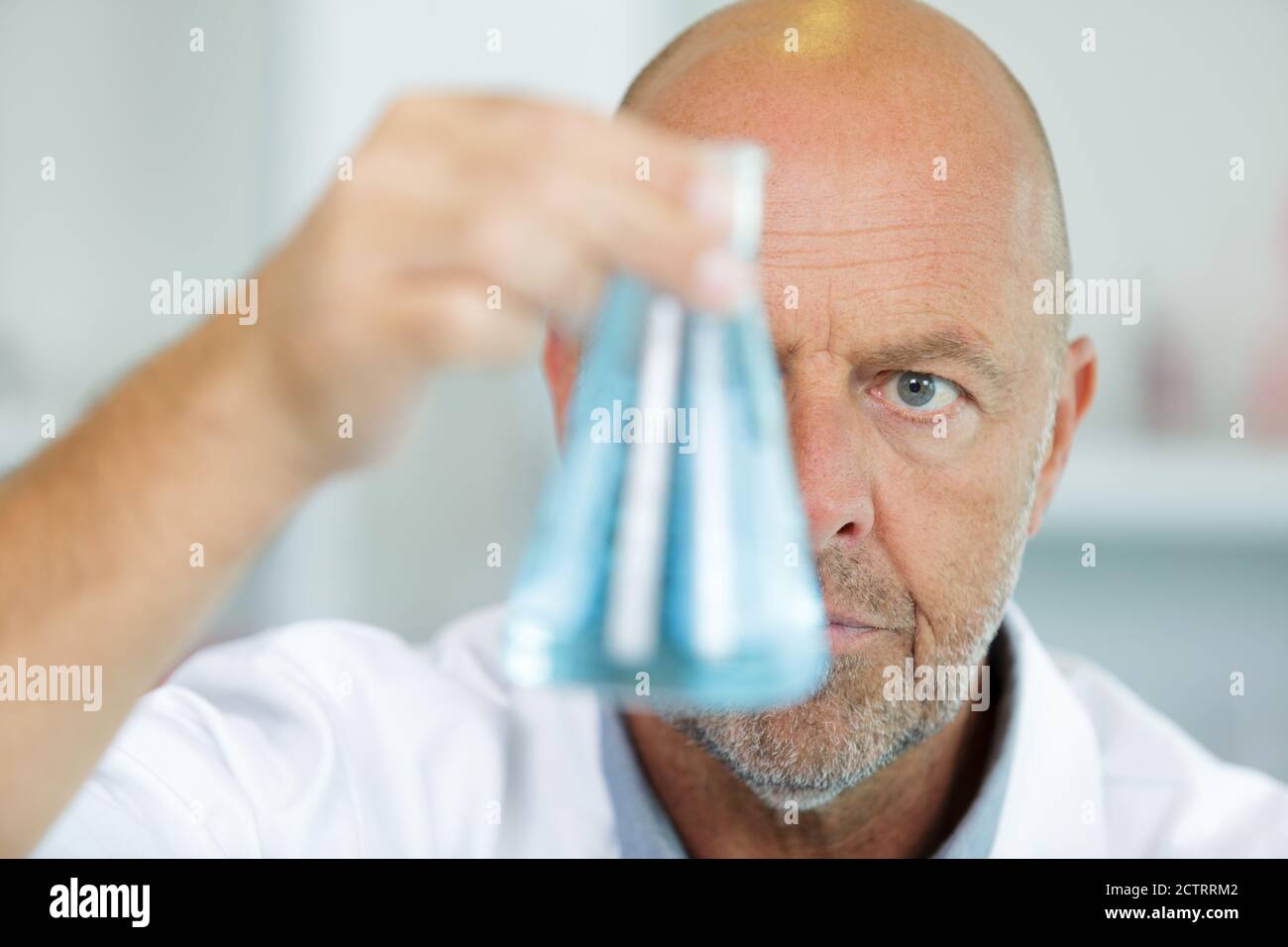 Scientist holding flask water sample hi-res stock photography and ...