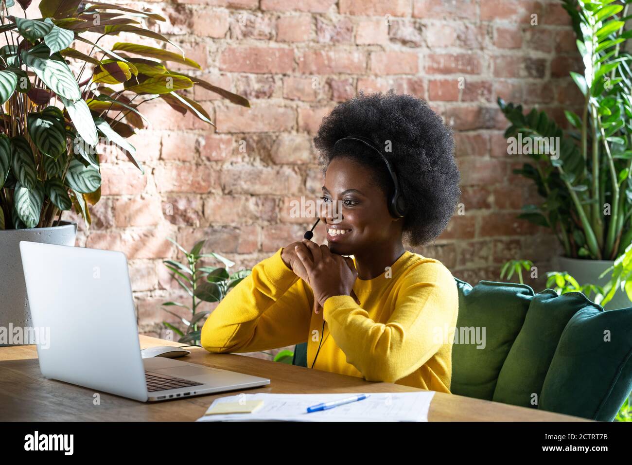 Side view smiling Afro-American biracial millennial woman wearing ...