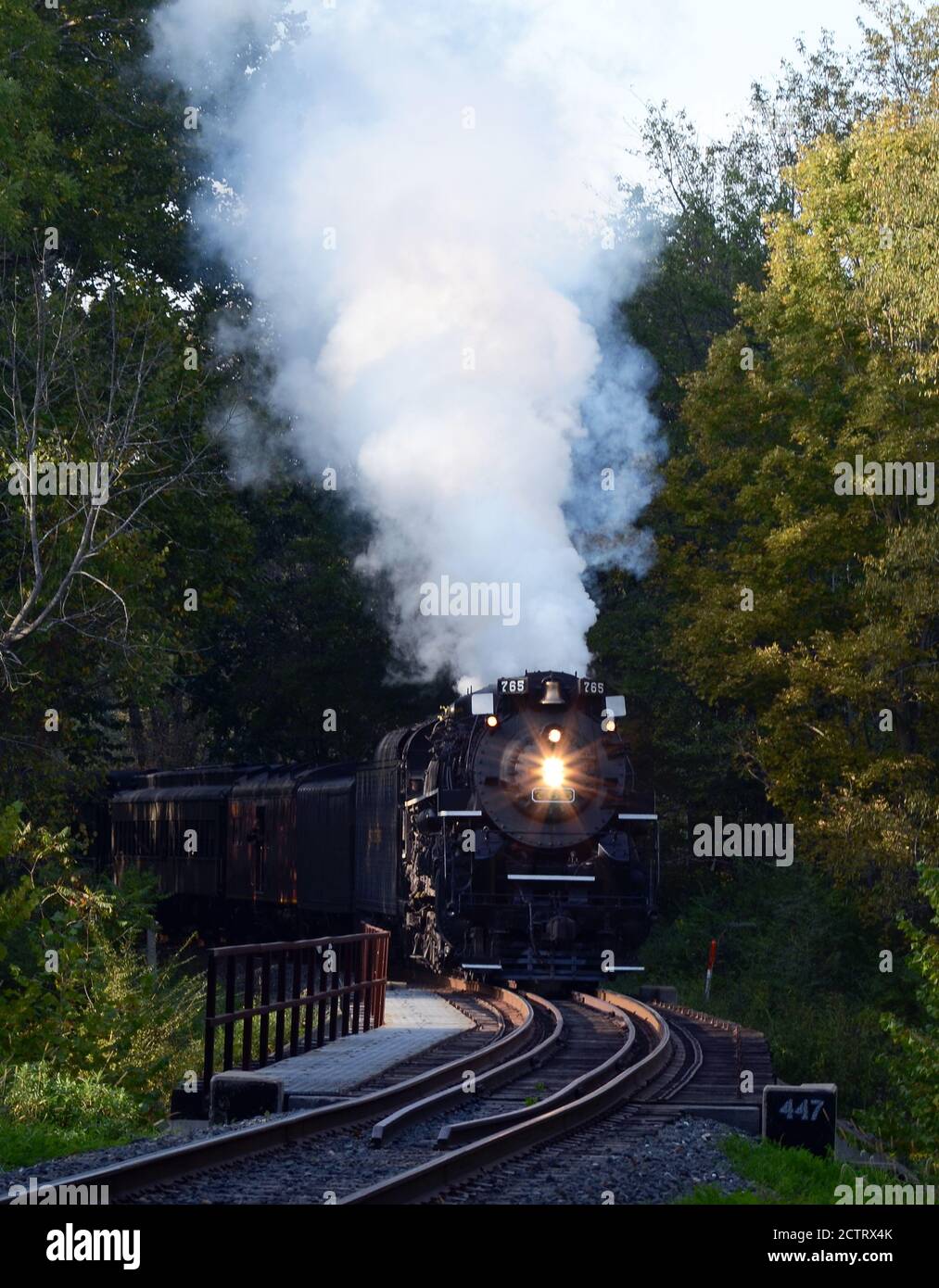 Steam Engine 765 rounds the bend to cross a bridge over the Cuyahoga ...