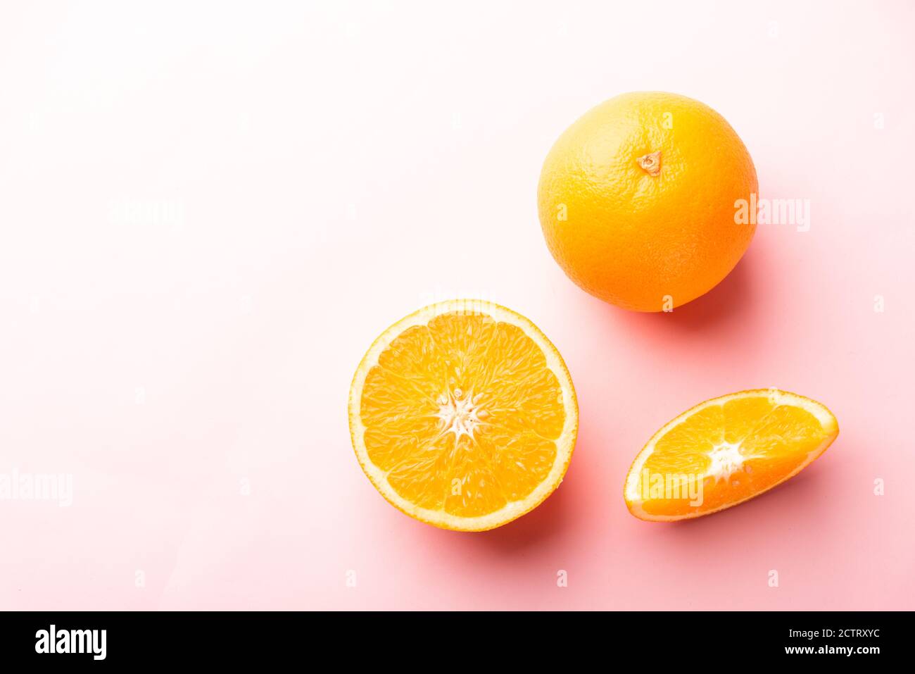 Top view of Fresh half orange fruit slice and full orange in the studio ...