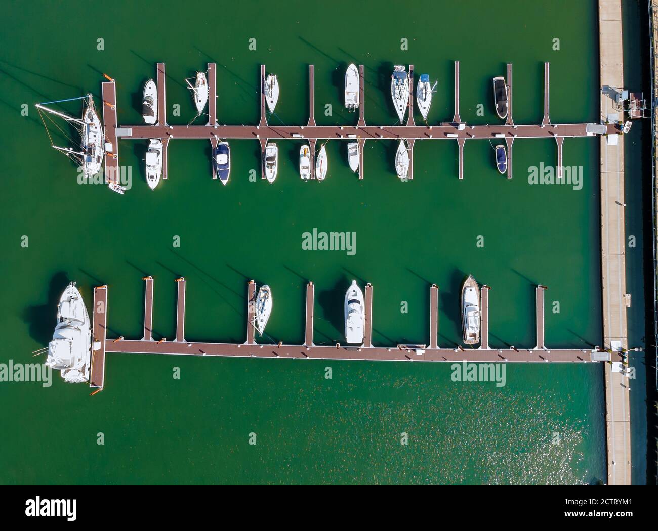 Aerial over small marina on a dock basin in small harbor, aerial view ...