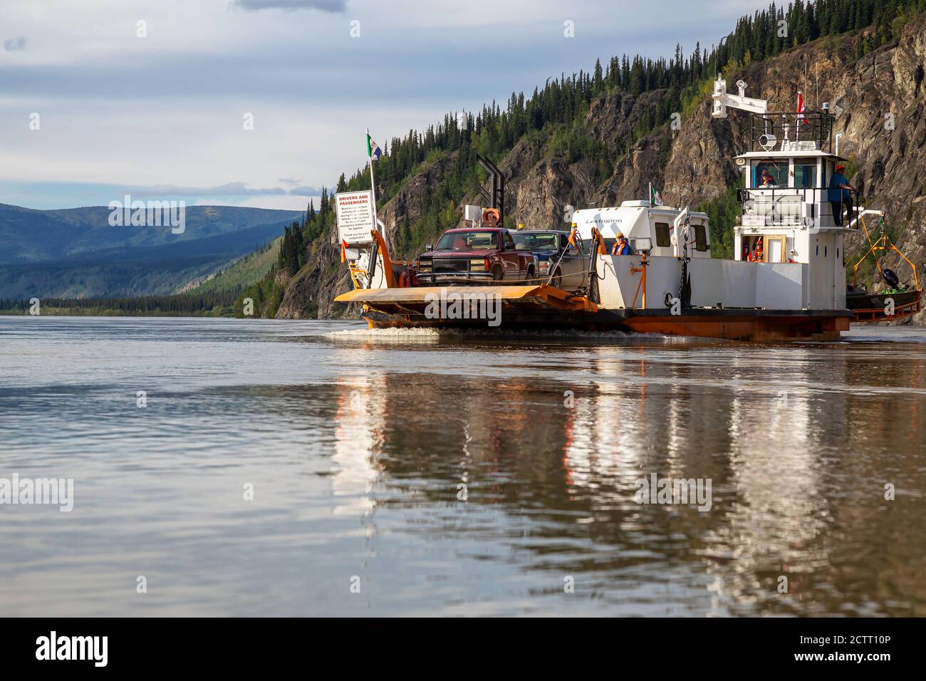 Small Ferry Crossing the River with Cars Stock Photo - Alamy