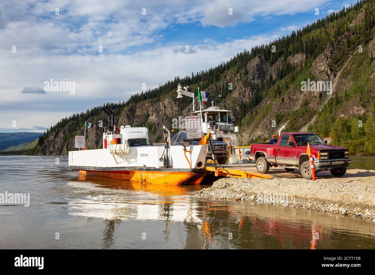Small Ferry Crossing the River with Cars Stock Photo - Alamy