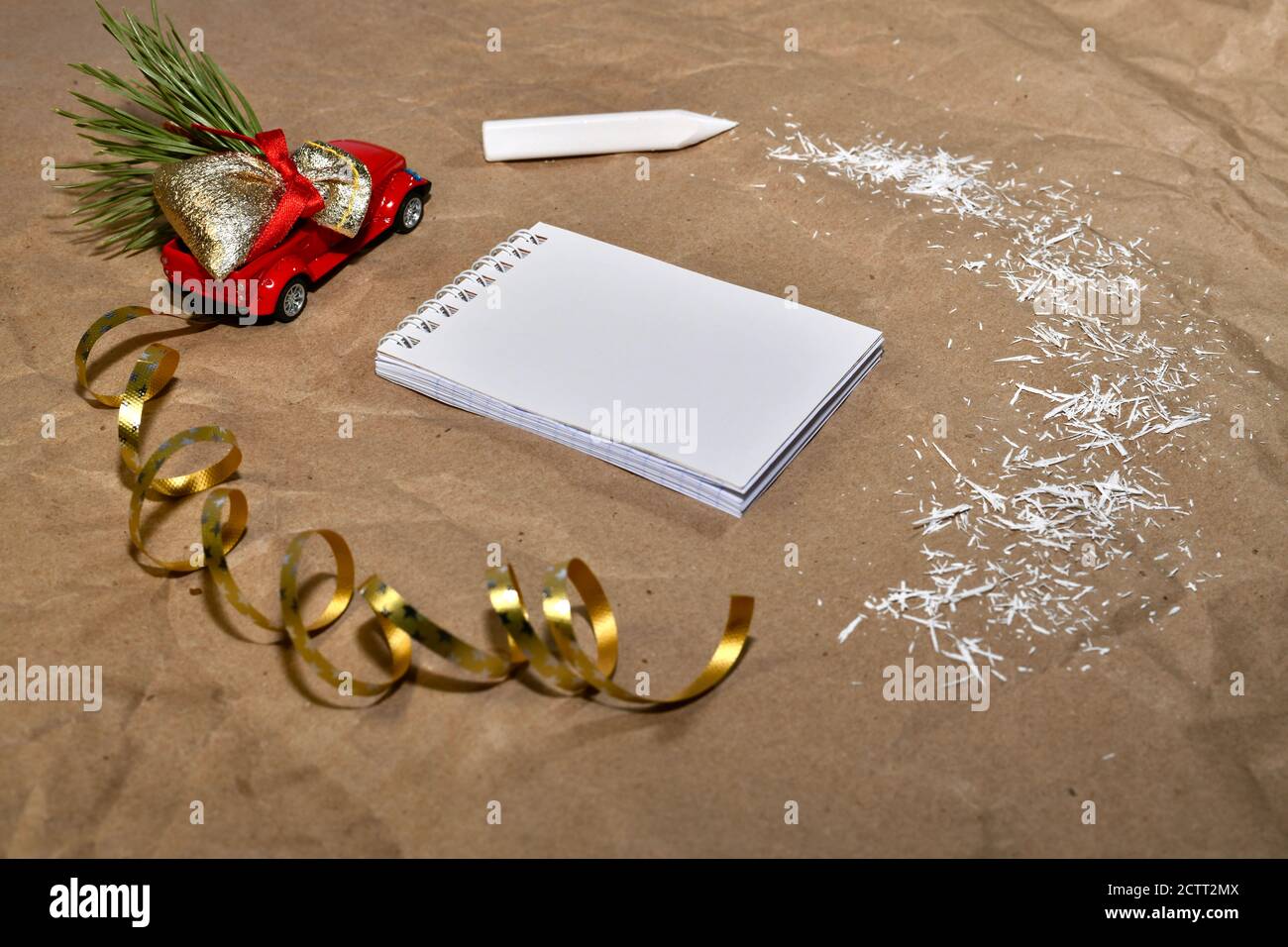 A small notepad in the center of the trail from the red car on the ring ...