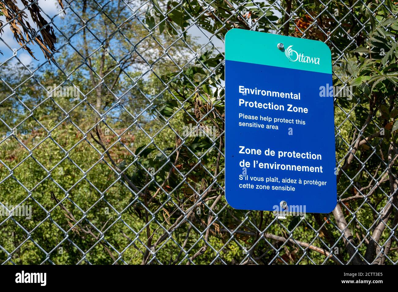 A City of Ottawa sign on a chain link fence informs visitors to ...