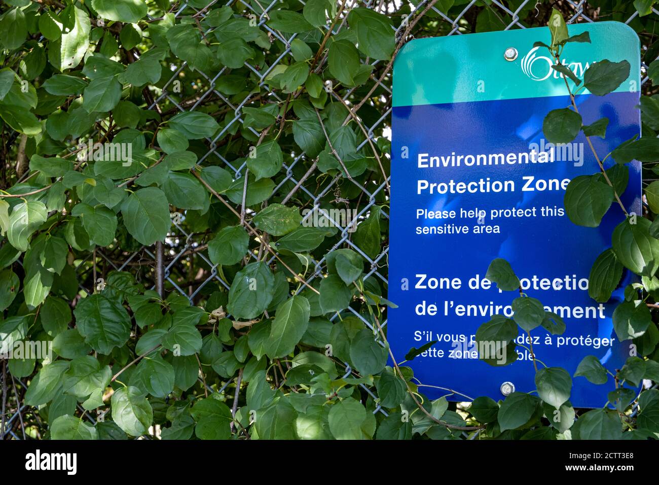 A City of Ottawa sign on a chain link fence informs visitors to ...