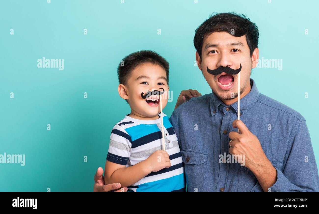 Family funny happy hipster father and his son kid holding black ...