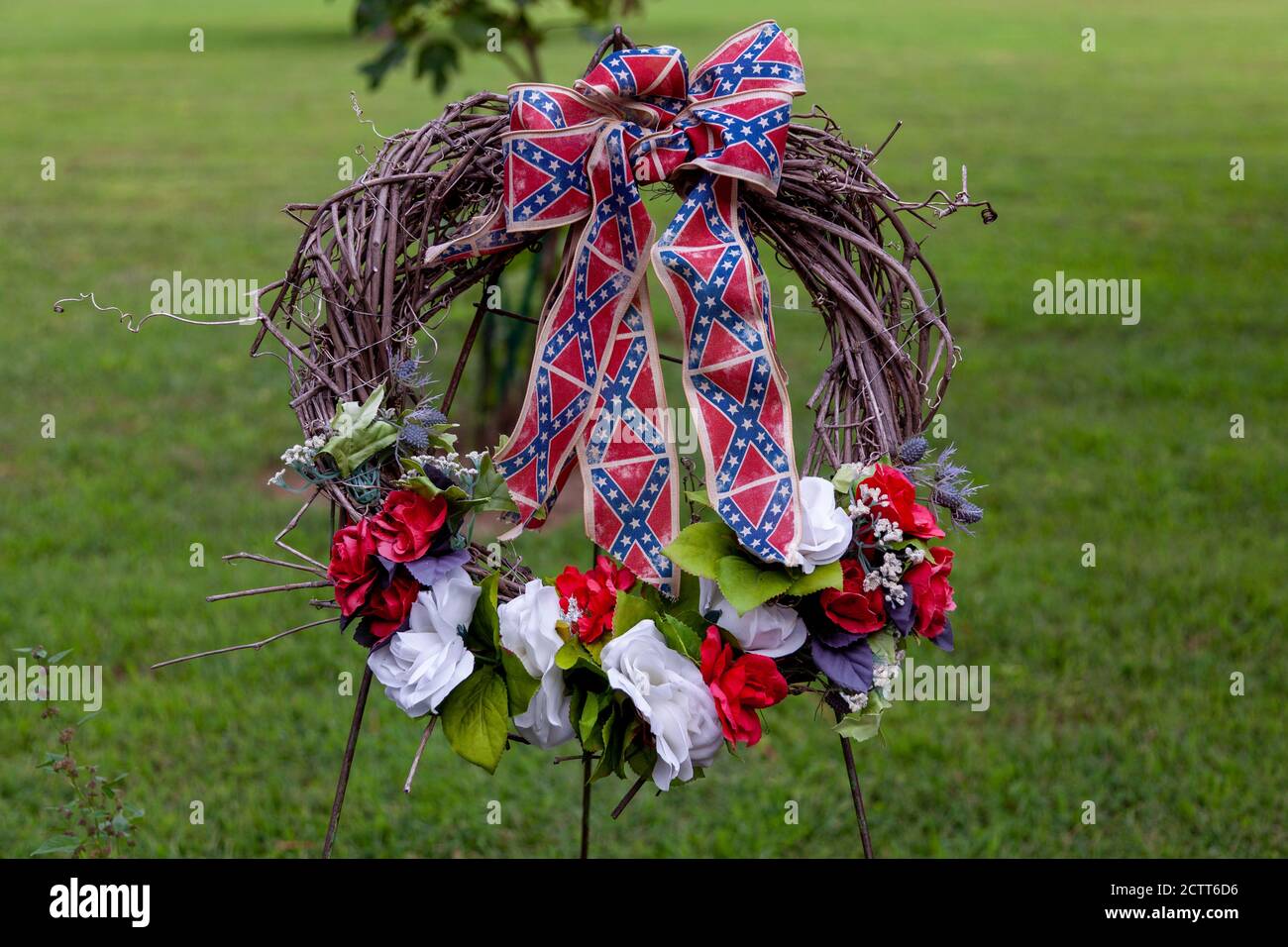A wreath of blue, white and red flowers with Confederate flag themed ...