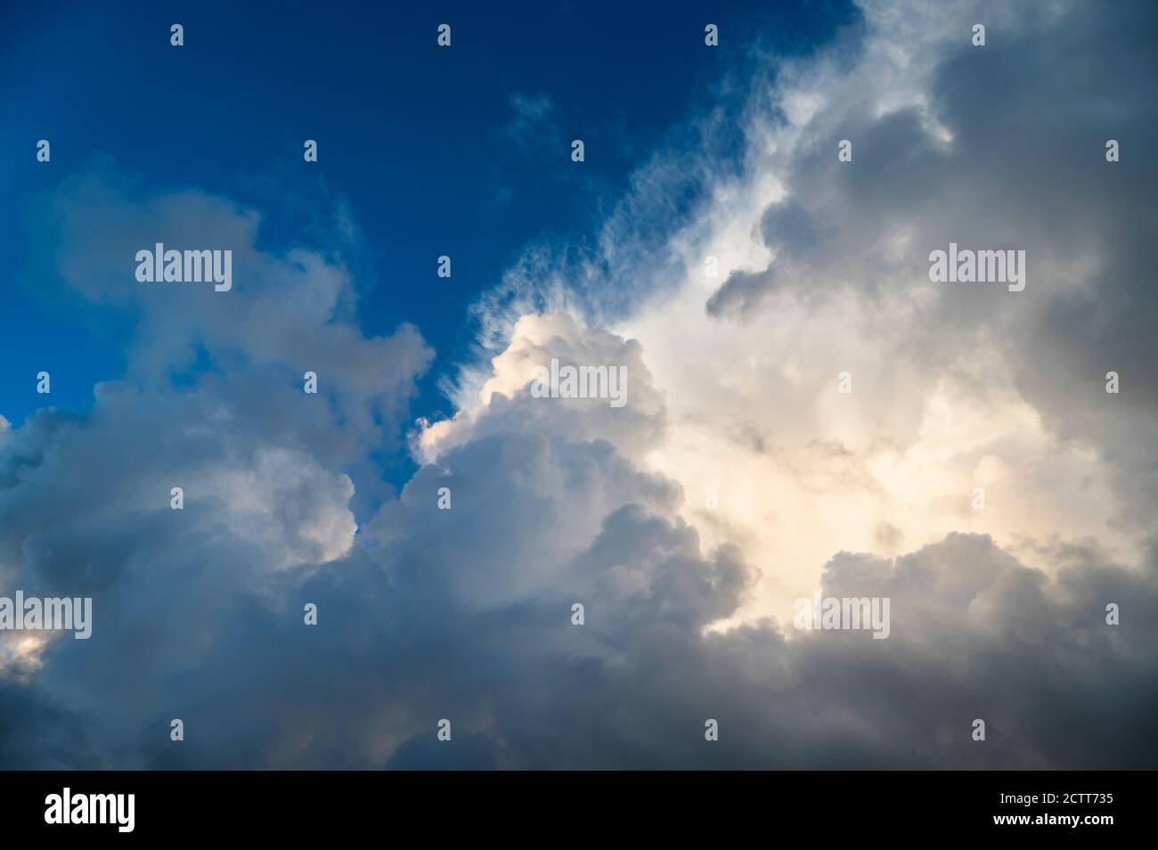 Cumulus clouds lit by sun Stock Photo - Alamy