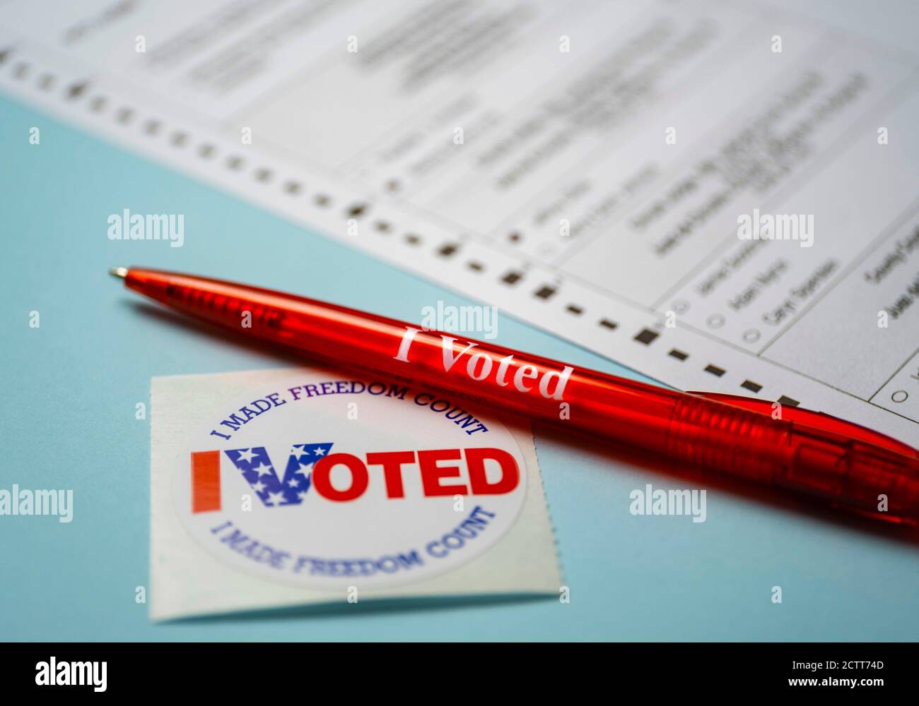 Voting form with pen and badge on blue background Stock Photo - Alamy