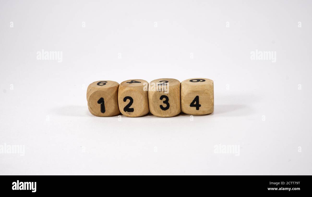 Four wooden dice on white background Stock Photo - Alamy