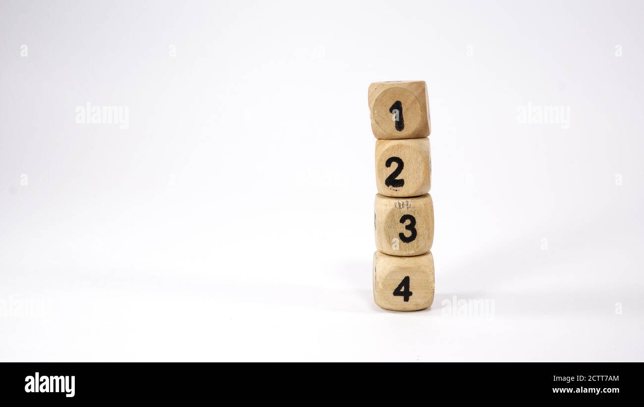 Four wooden dice on white background Stock Photo - Alamy